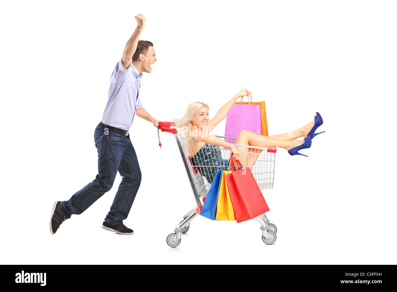 Couple pushing a shopping cart Cut Out Stock Images & Pictures - Alamy