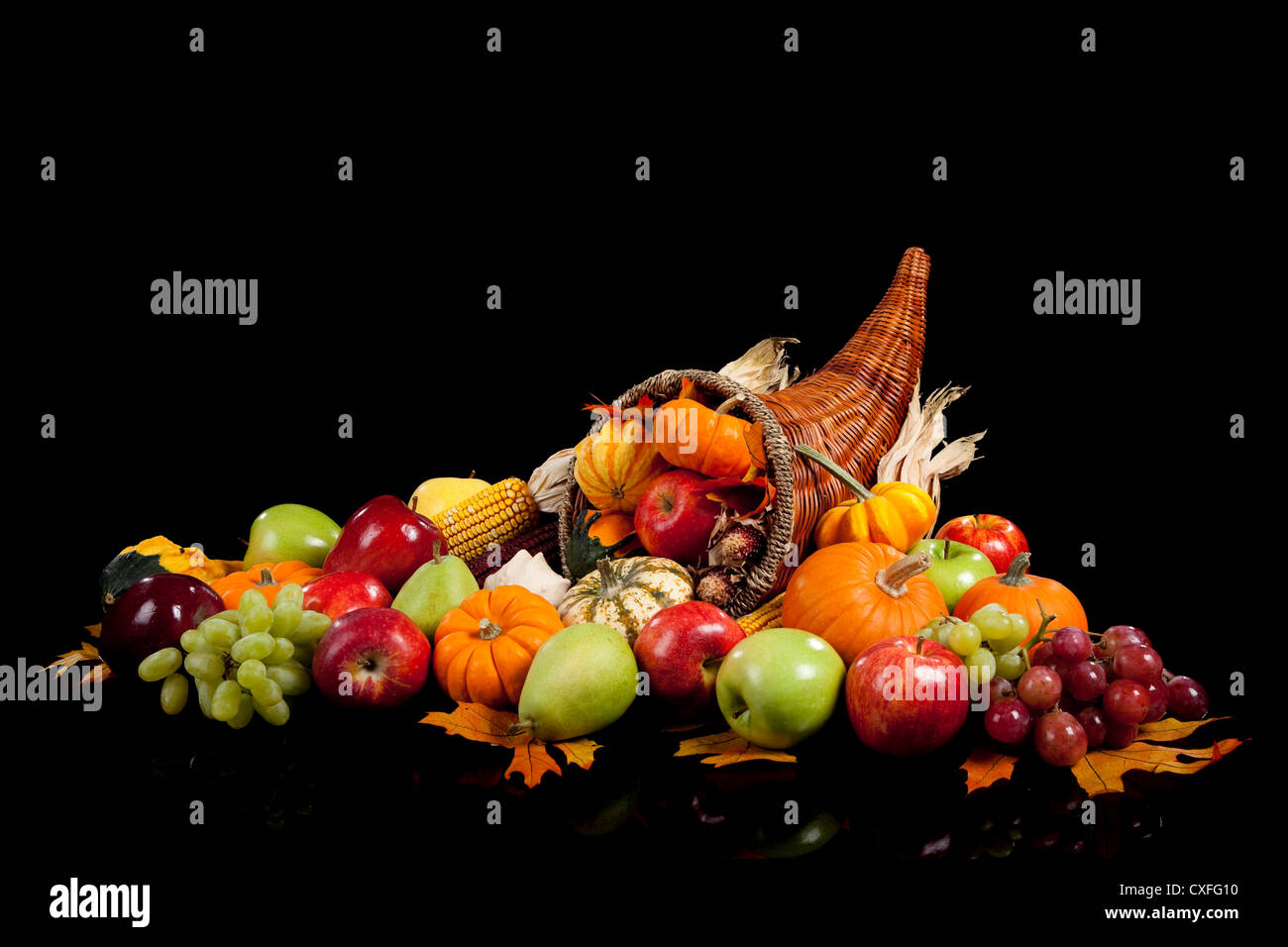 Cornucopia full on a black background Stock Photo - Alamy