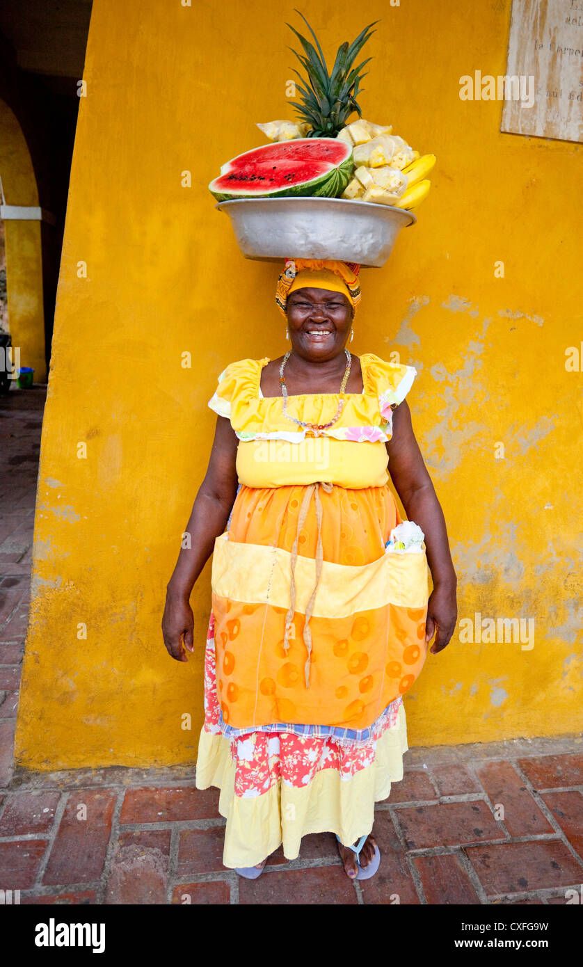 Full length portrait of traditional fruit sellers from Palenque ...