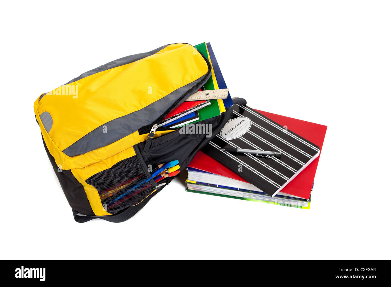 yellow backpack with books Stock Photo - Alamy