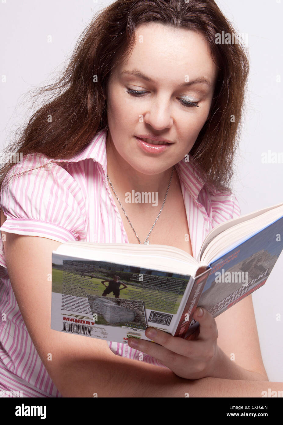 Attractive woman reading a book Stock Photo - Alamy