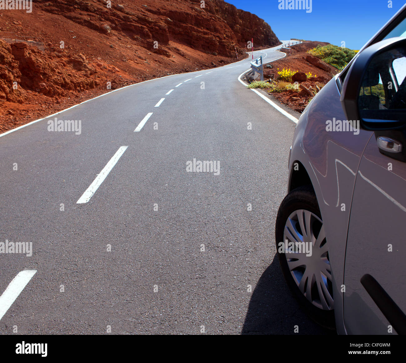 Canary Islands winding road curves and car driving Stock Photo - Alamy