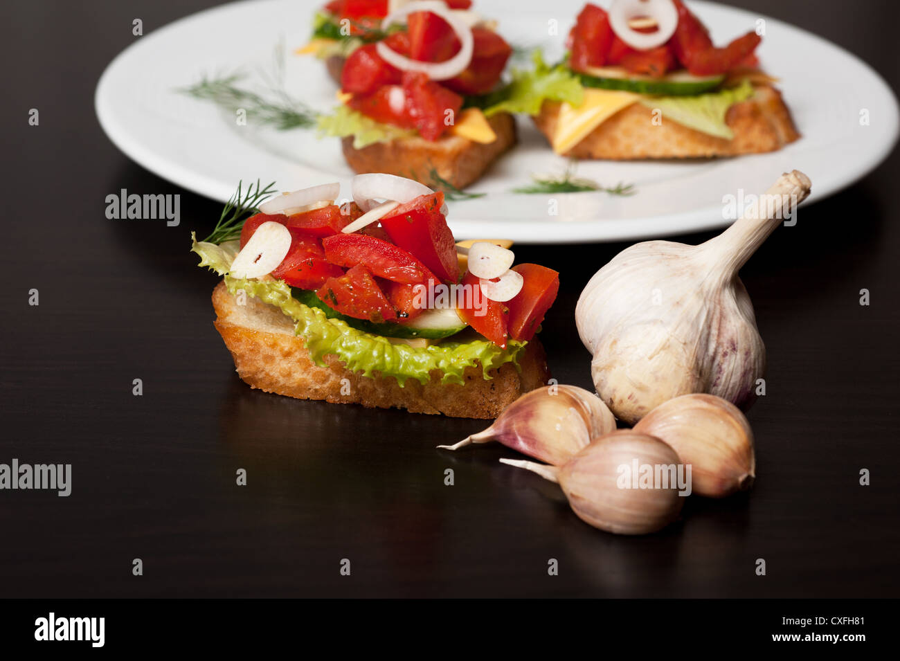 Toast with vegetables, cheese, tomato, pepper, onion, cucumber and ...