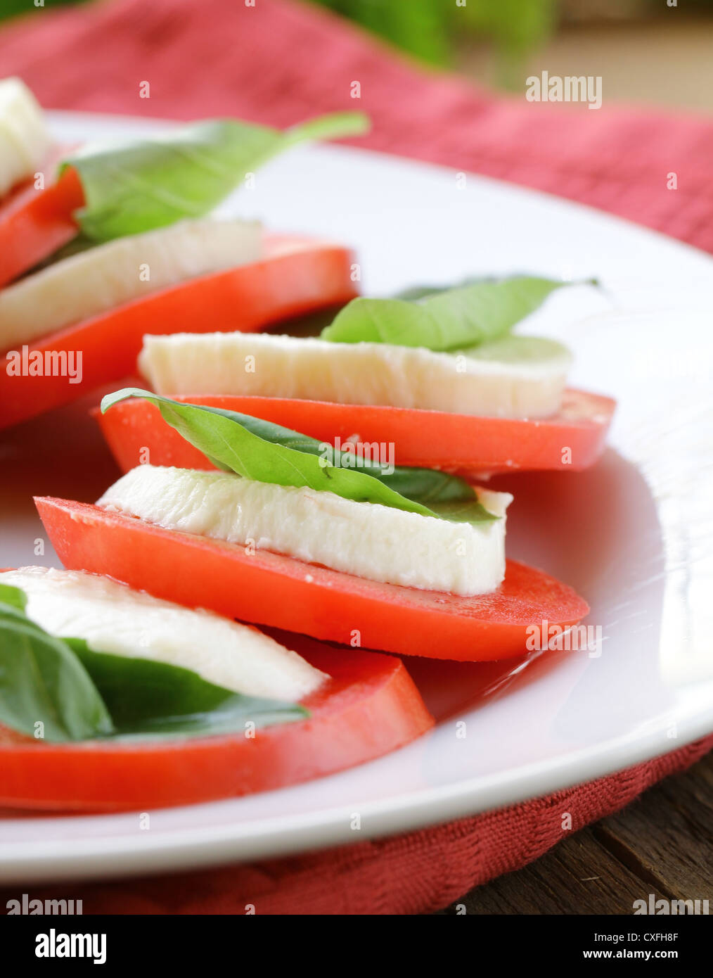Italian salad with mozzarella cheese and tomato Stock Photo - Alamy