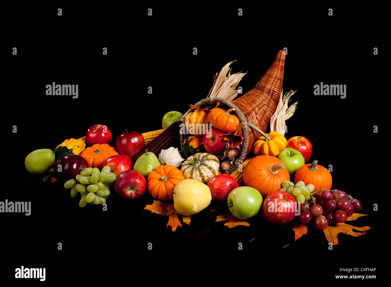 A overflowing cornucopia on a white background Stock Photo - Alamy