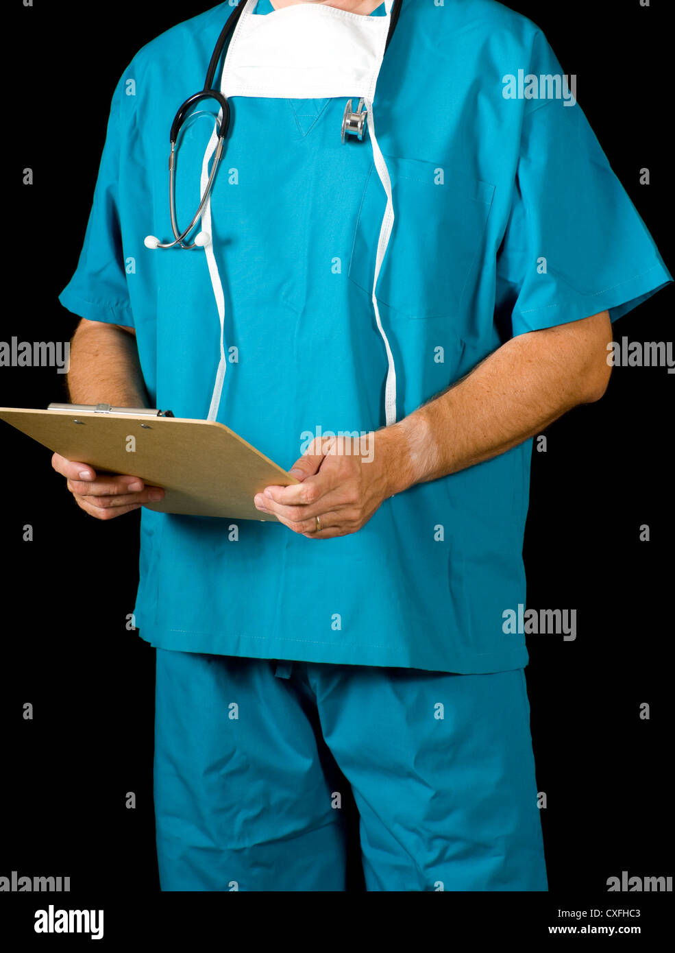A man in scrubs with a stethoscope holding a clipboard Stock Photo - Alamy