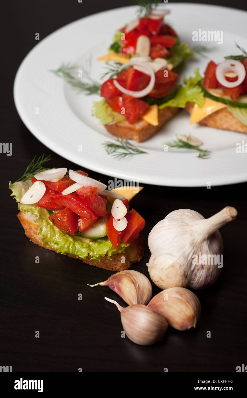 Toast with vegetables, cheese, tomato, pepper, onion, cucumber and ...