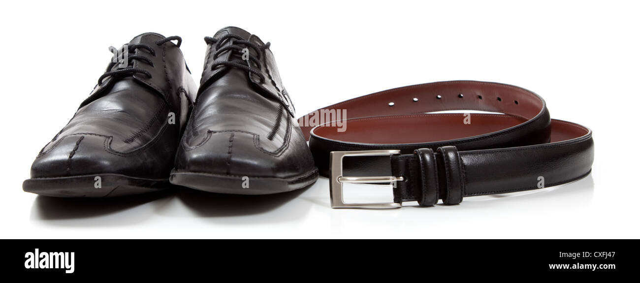 Black dress hoes and leather belt on a white background Stock Photo - Alamy
