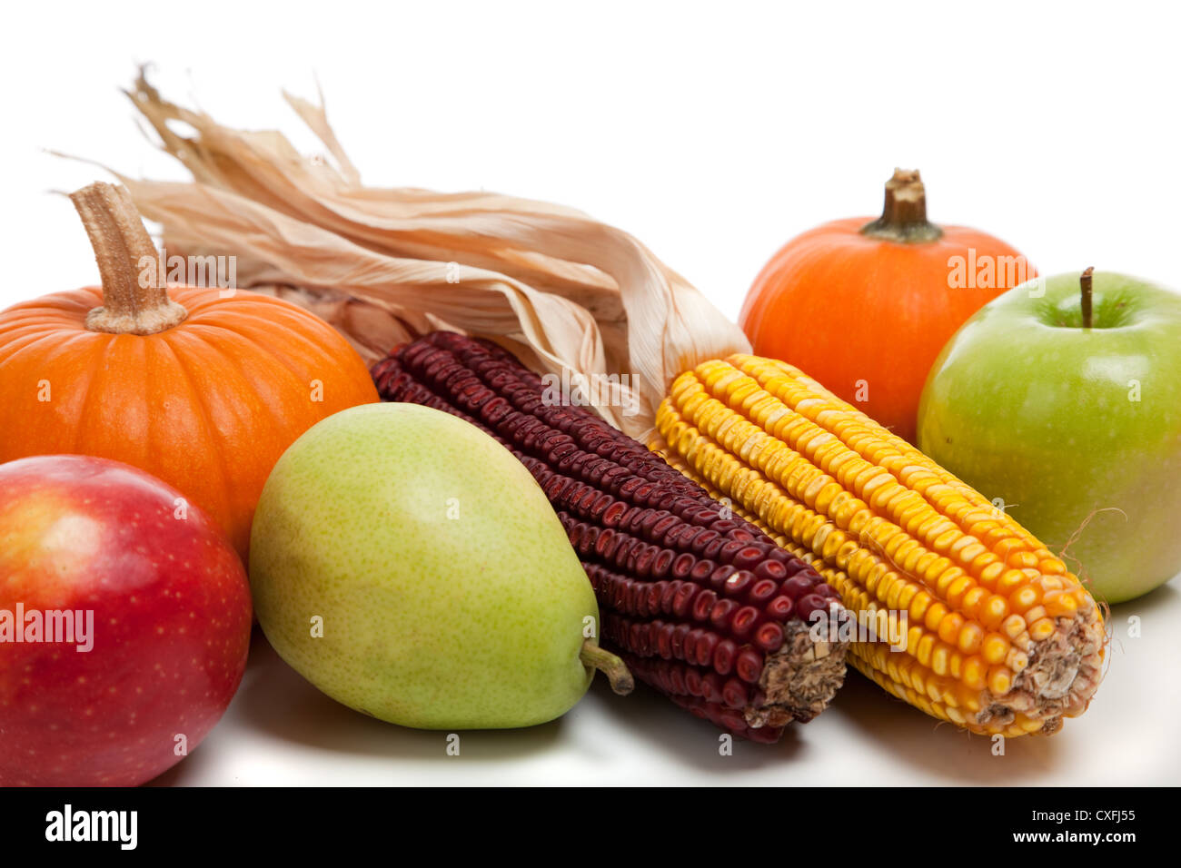 Fall decorations including pumpkins, gourds, Indian corn and pears ...