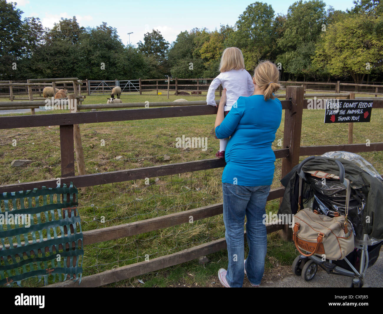 Mother and daughter watch animals during visit to the Hackney City Farm ...