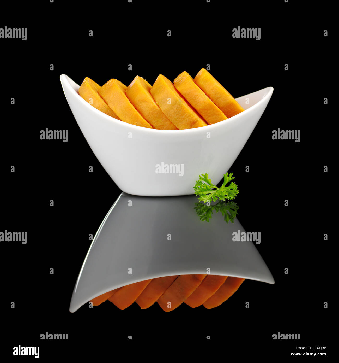 Cooked sweet potato slices (lat. Ipomoea batatas) in white bowl ...