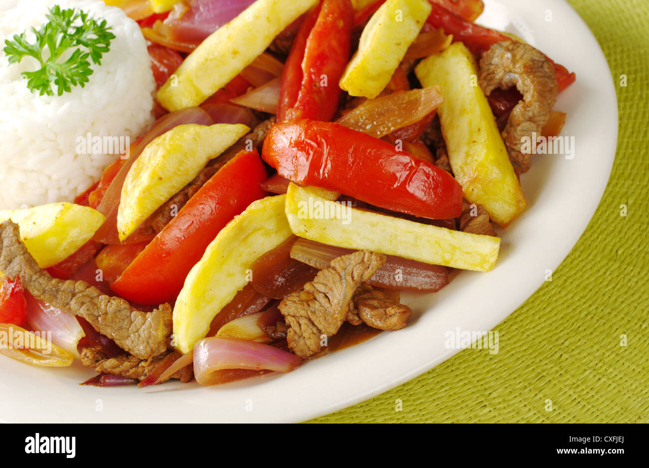 Peruvian dish called Lomo Saltado which is made of beef, onions ...