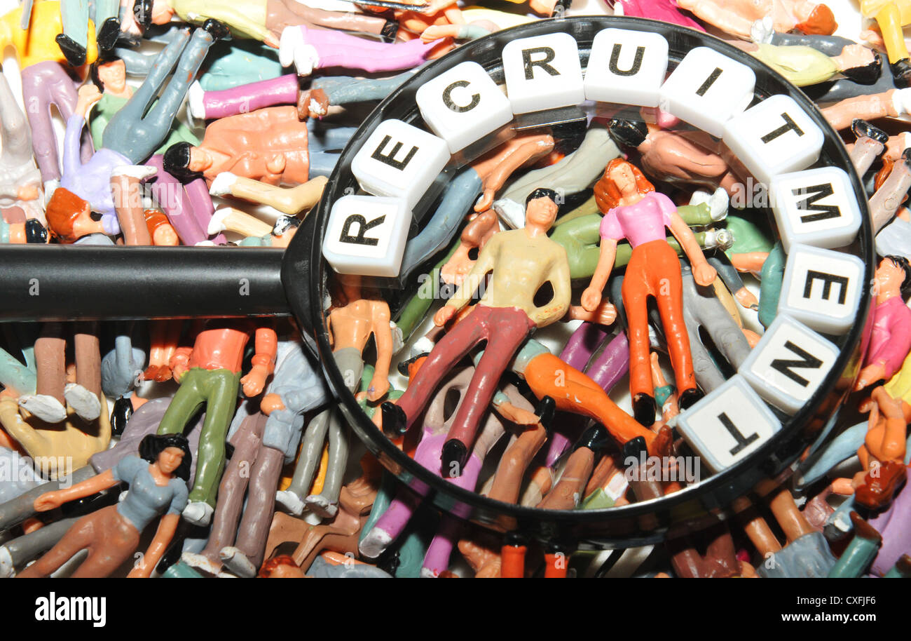 Recruitment concept with magnifying glass and miniature people Stock ...