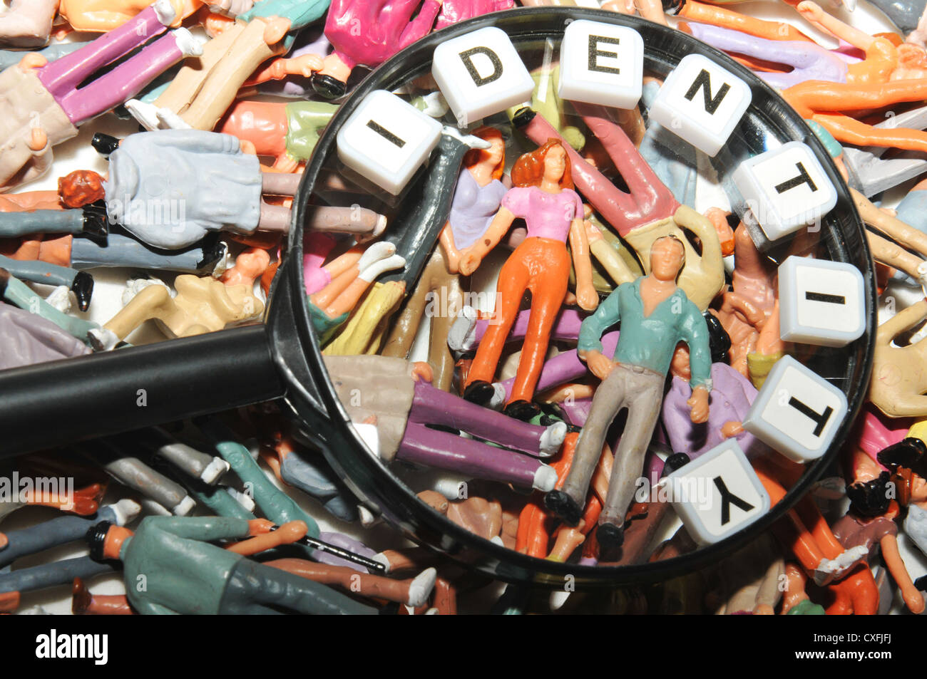Identity concept with magnifying glass and miniature people Stock Photo ...