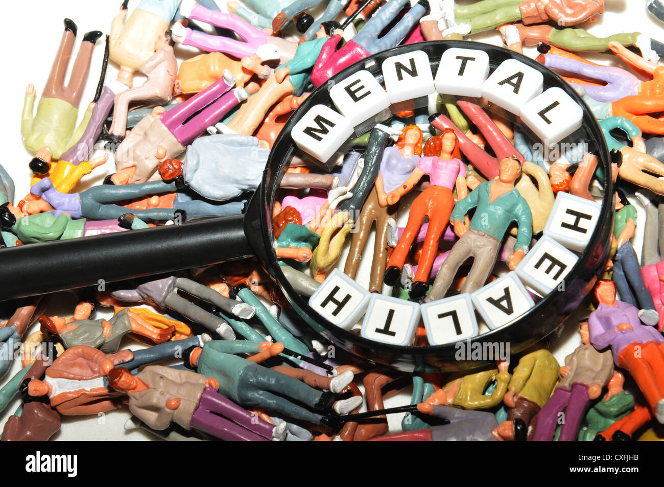Mental health concept with magnifying glass and miniature people Stock ...