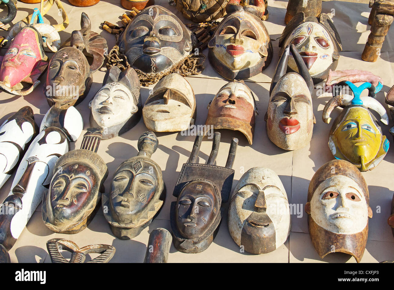 African masks on the traditional market Stock Photo - Alamy
