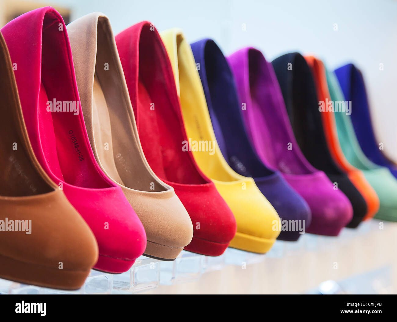 variety of the colorful leather shoes in the shop Stock Photo - Alamy