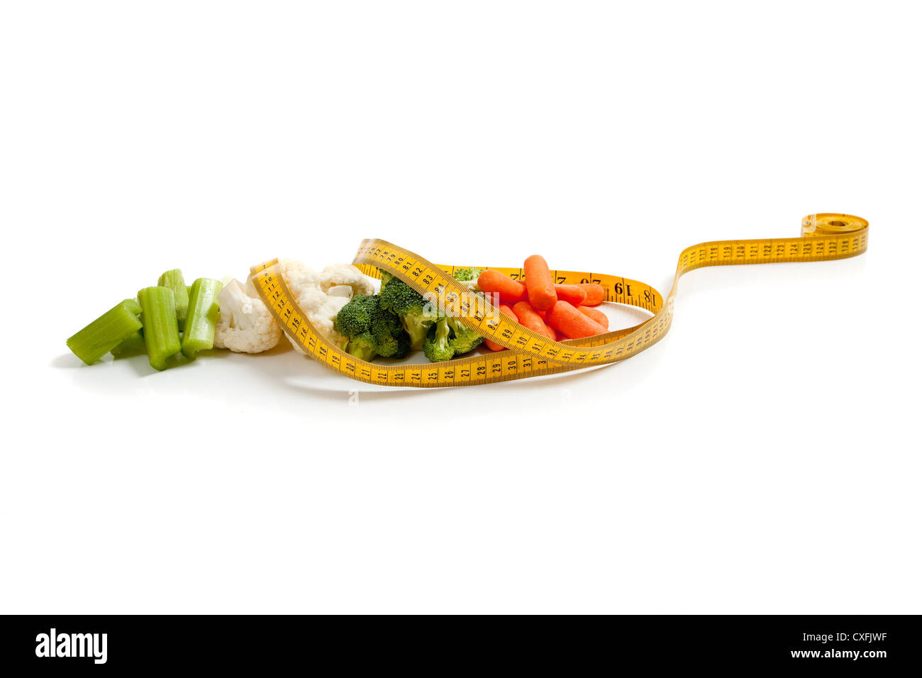 Fresh vegetables and a tape measure on a white background Stock Photo ...