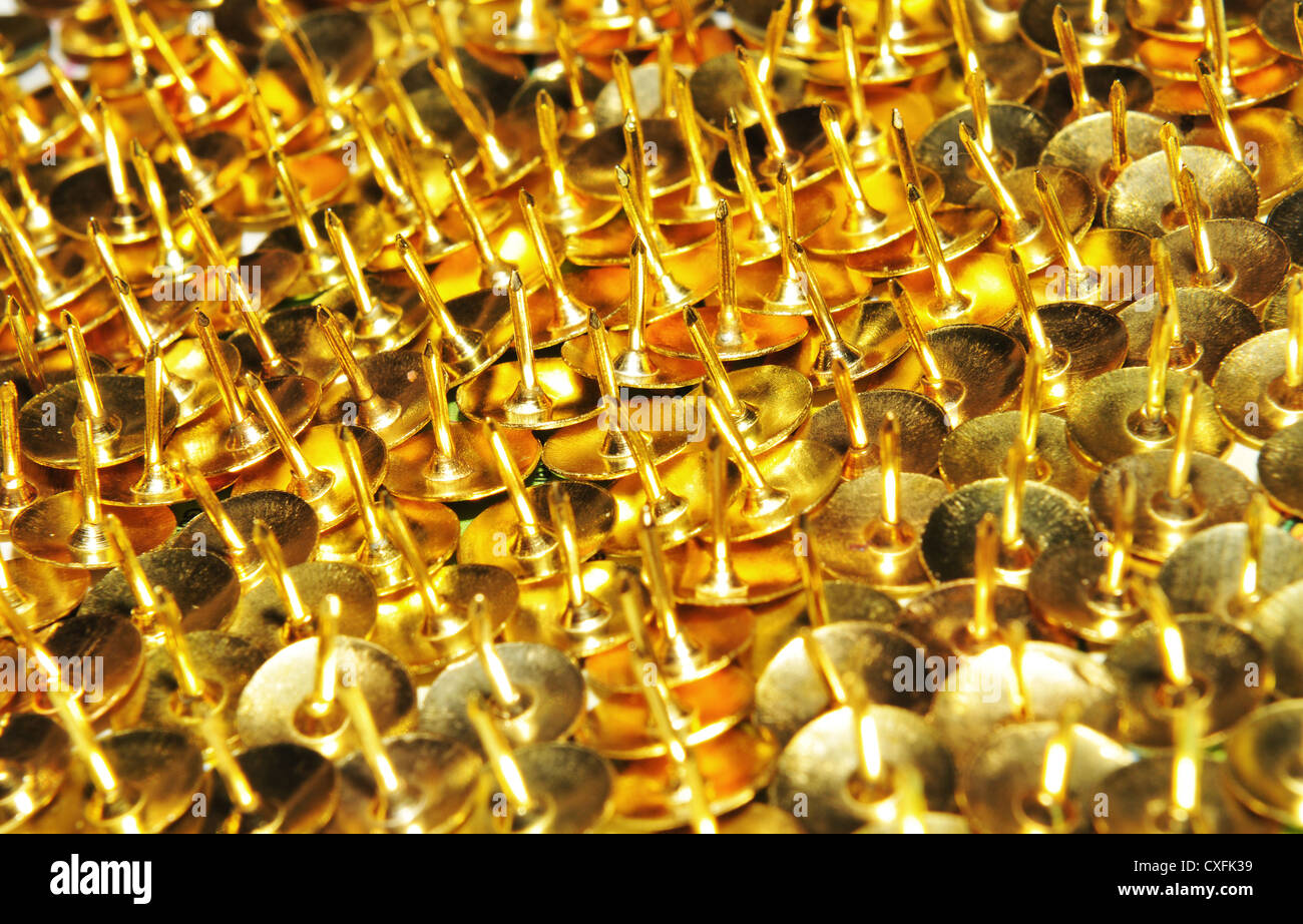 Golden drawing (push) pins background Stock Photo - Alamy