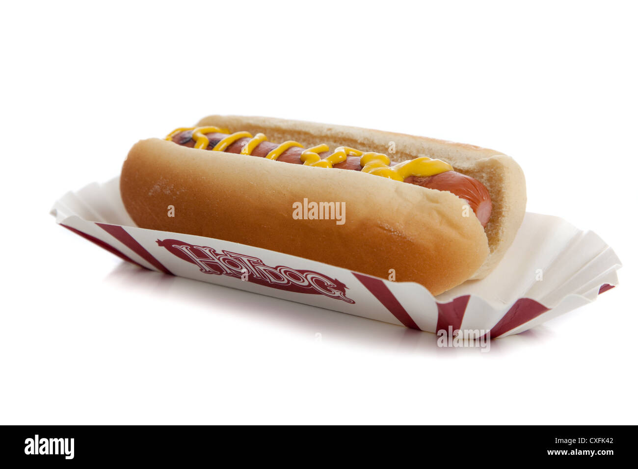 Single hot dog on a bun with mustard on a white background Stock Photo ...