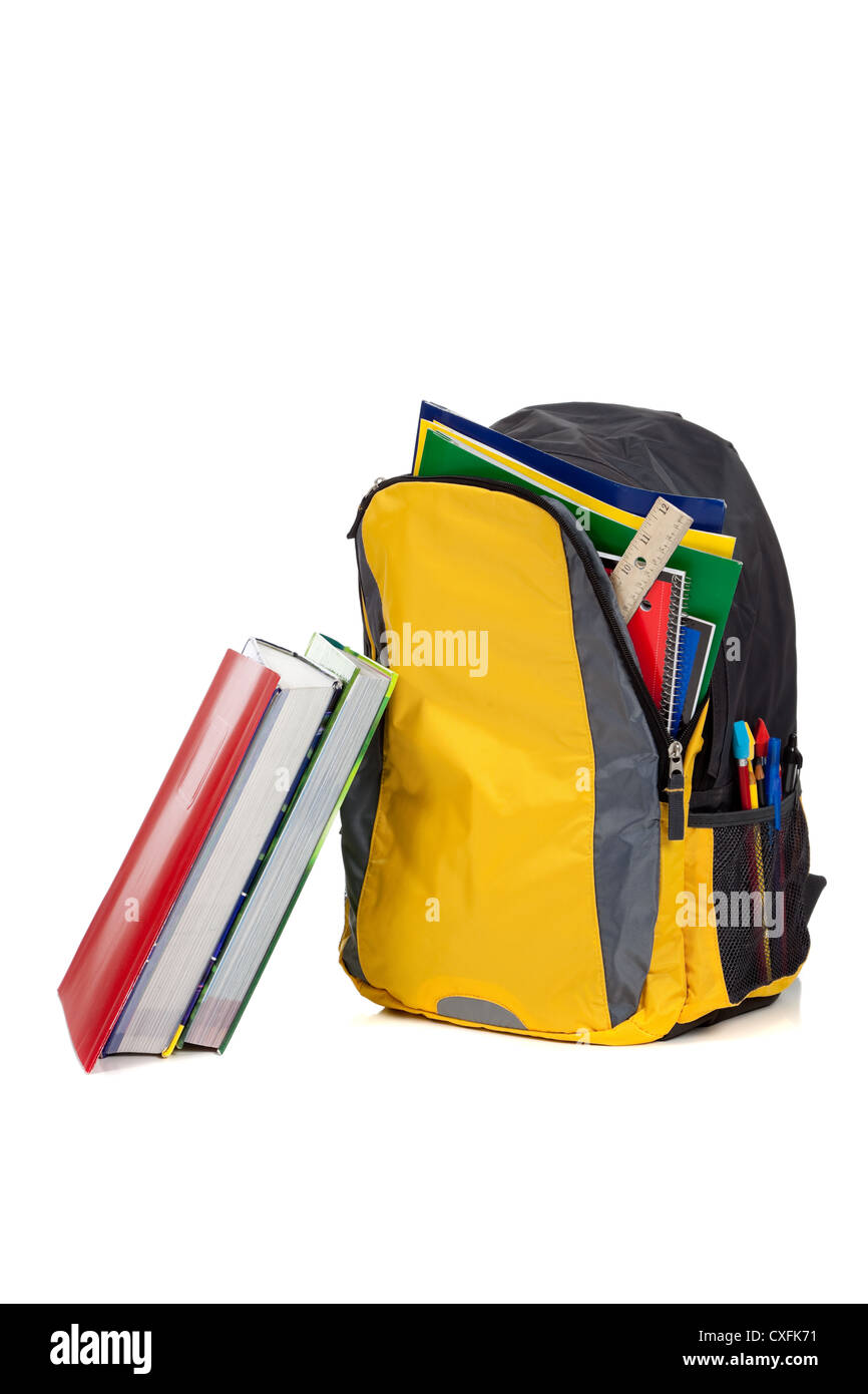Yellow backpack with school books on a white background Stock Photo - Alamy