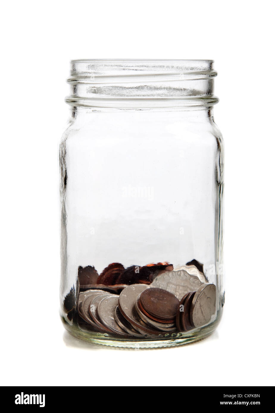 Clear jar of change on a white background Stock Photo - Alamy