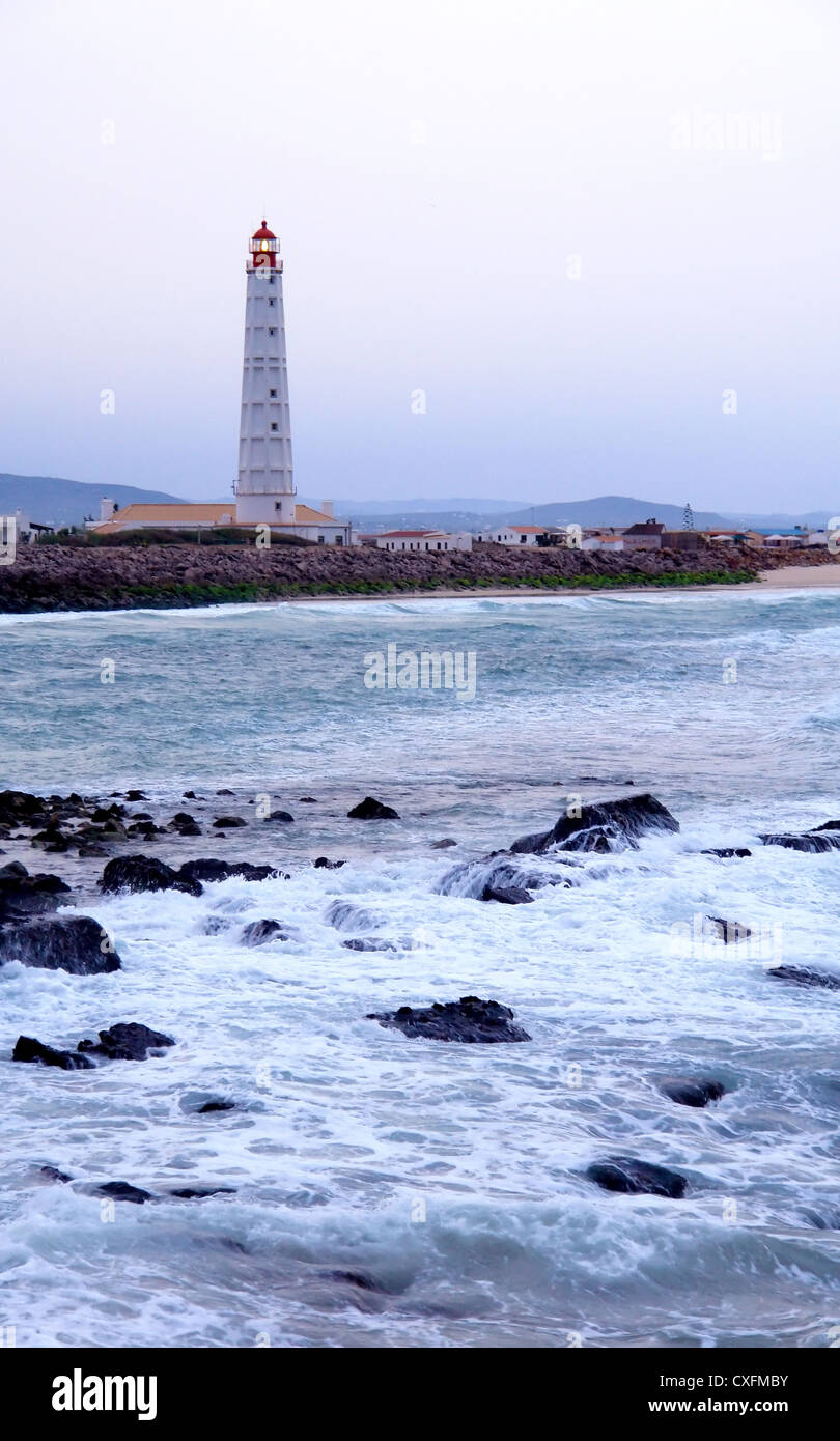 Lighthouse in "Farol" island at sunrise, Ria Formosa, natural ...