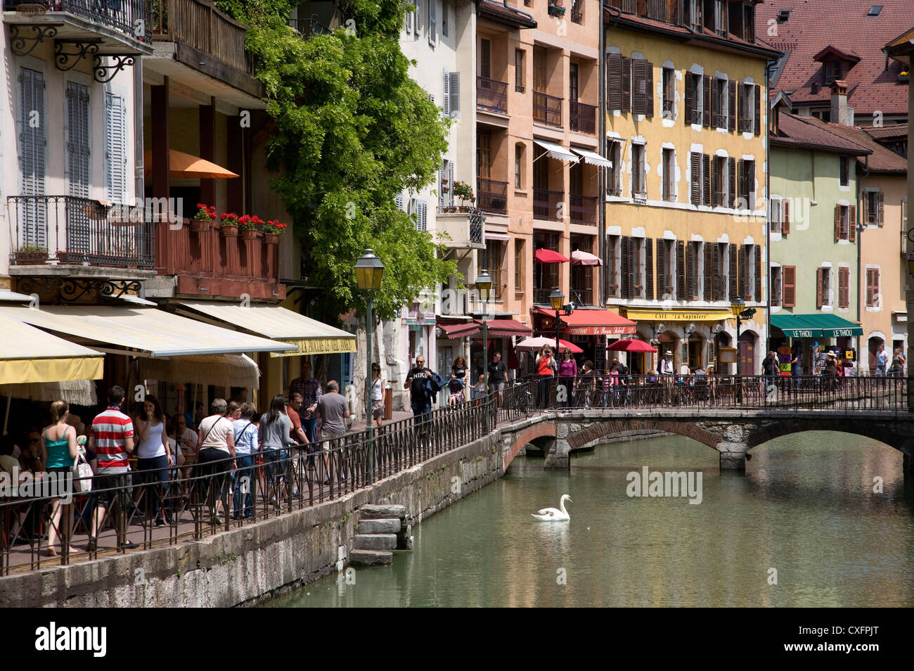 Colourful buildings overlooking a canal in Annecy in the Haute Savoie ...