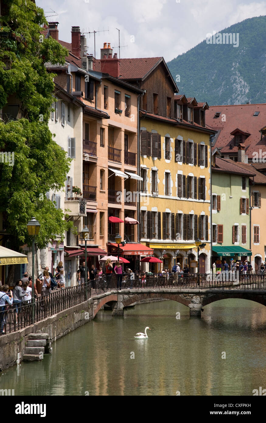 Colourful buildings overlooking a canal in Annecy in the Haute Savoie ...