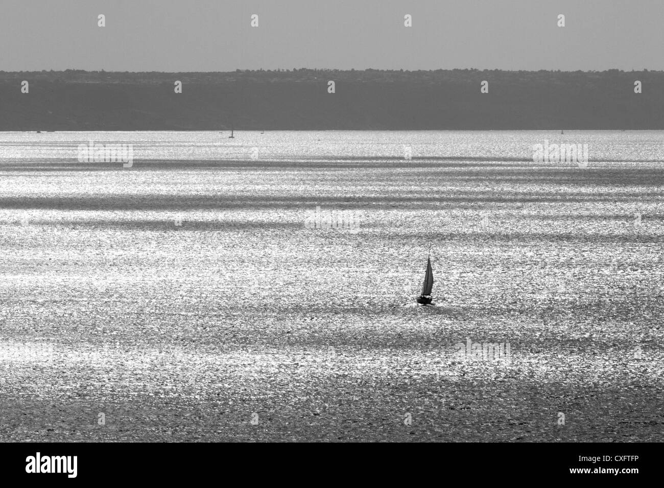 One sailing boat in Black and White Stock Photos & Images - Alamy