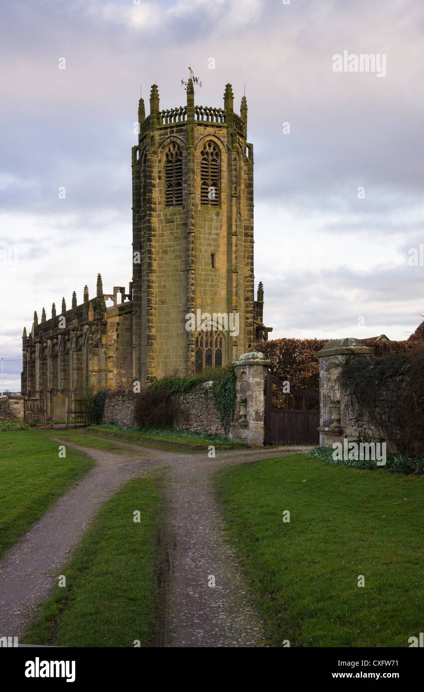 Sun illuminates the octagonal tower of St Michael's church as it sets ...