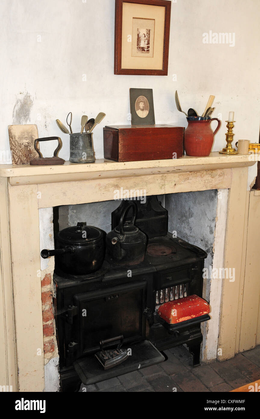 Stove and mantelpiece in the kitchen/living room, Whittaker's cottages ...