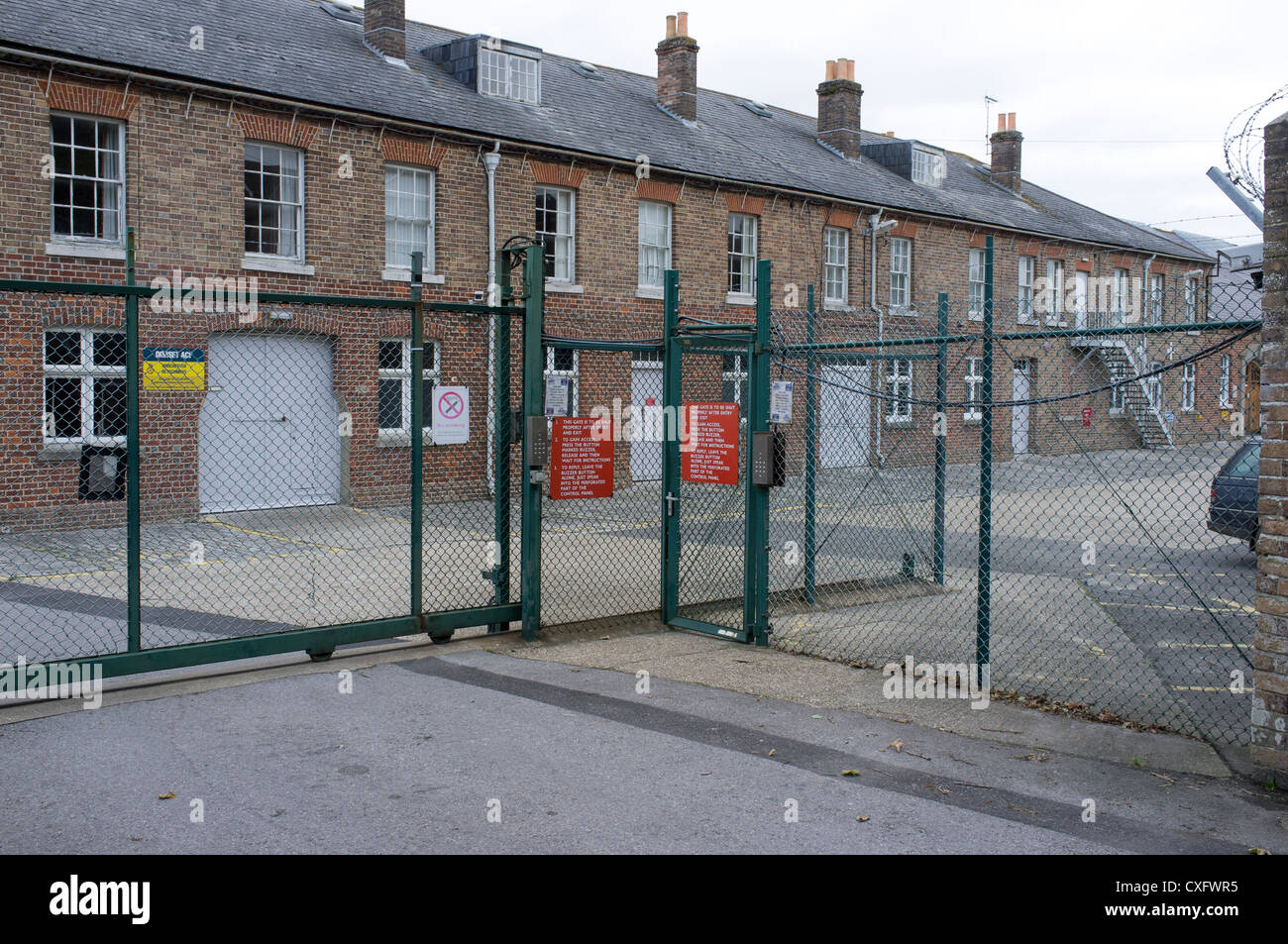 High security gates and fence at the entrance to Government Ministry of ...