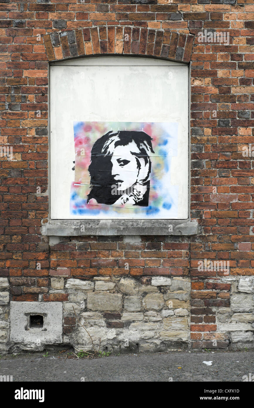 Street art poster of a womans face Stock Photo - Alamy