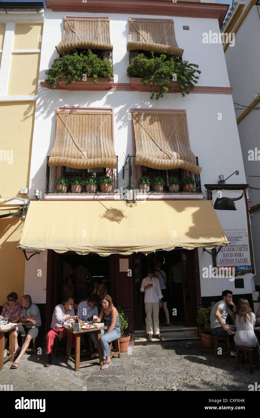 Pavement restaurant in the central old quarter of Seville Stock Photo ...