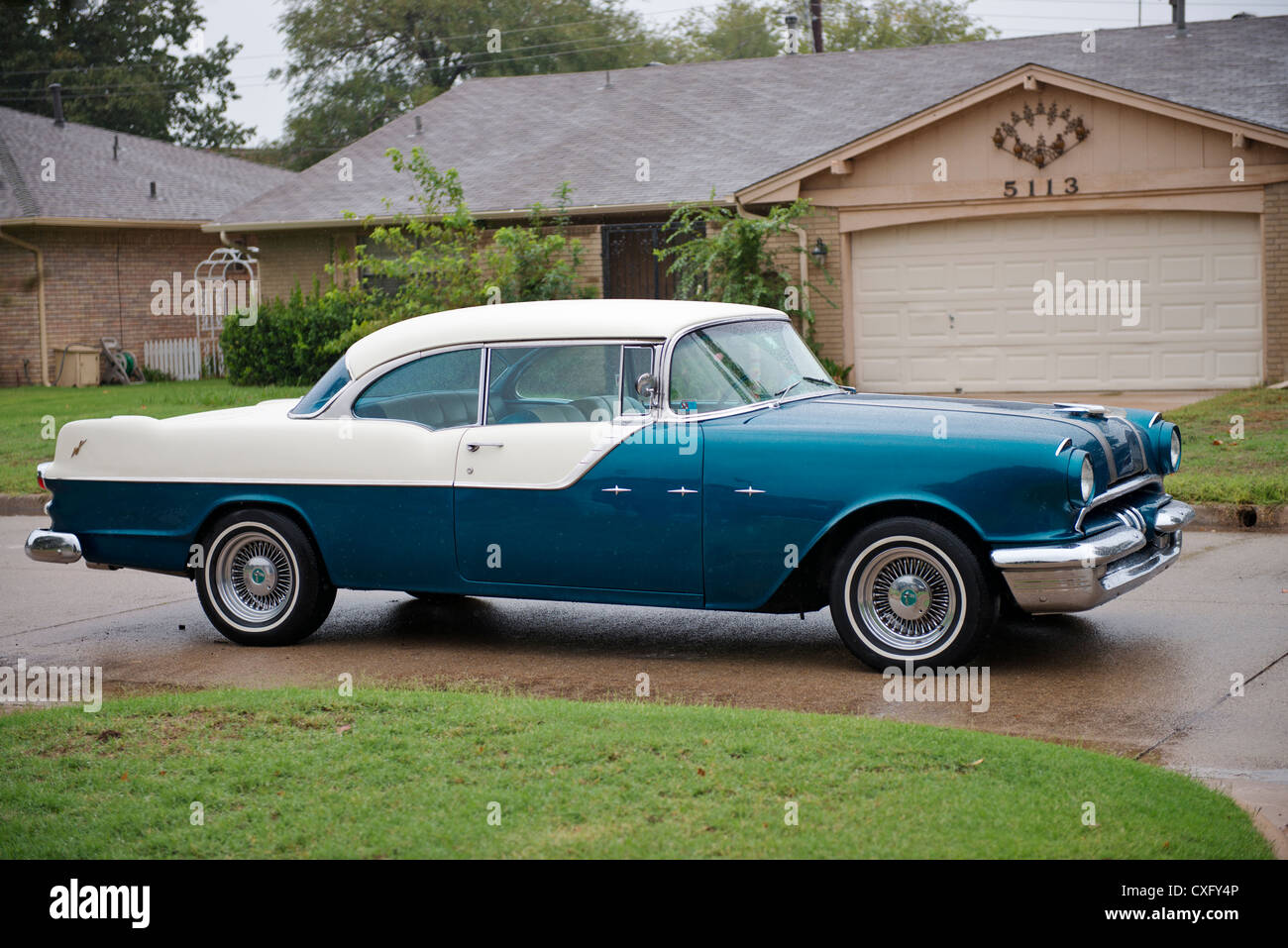 Classic 1955 Pontiac Star Chief two-door automobile. Passenger side ...