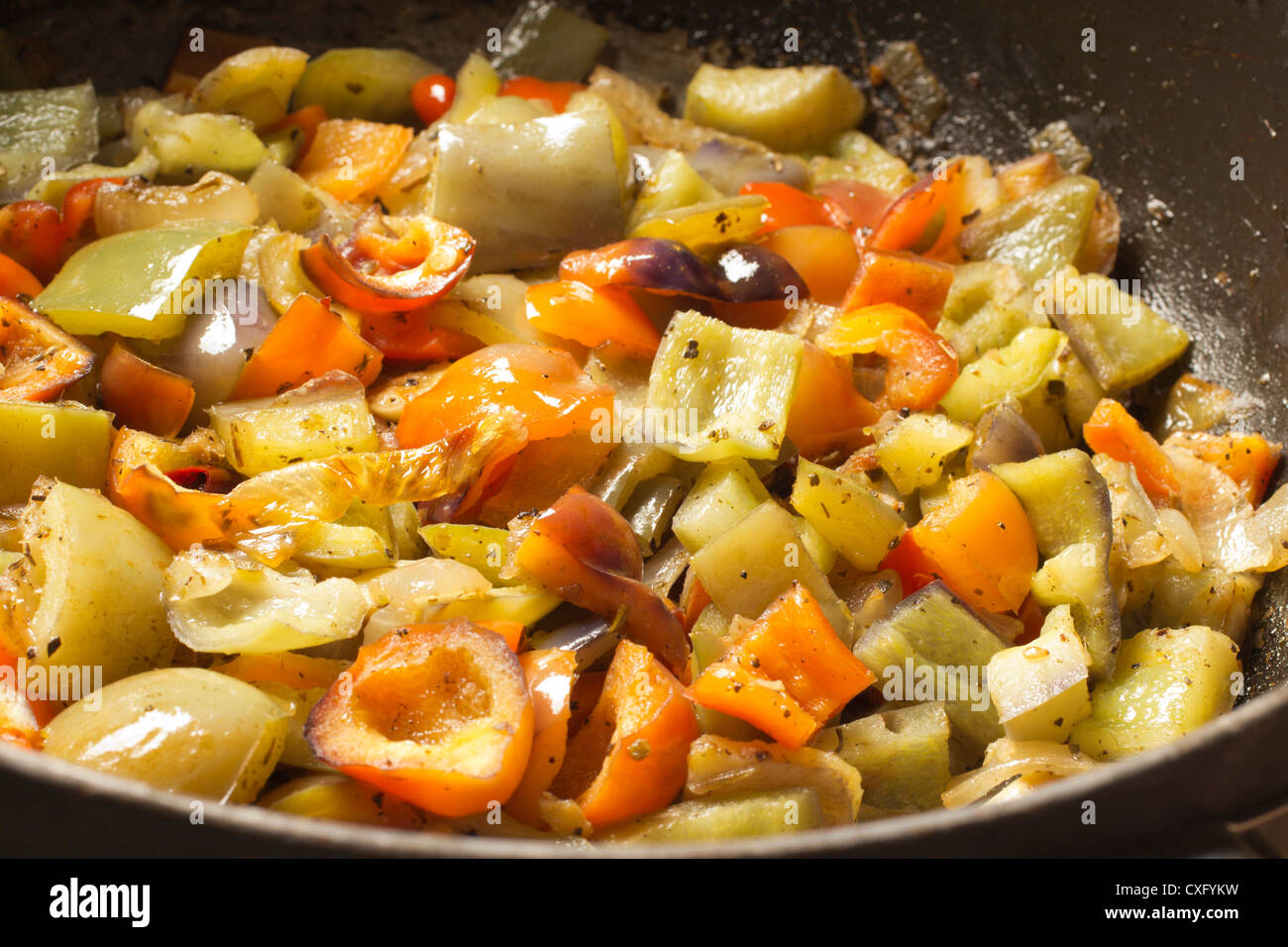 Bell peppers frying in a skillet Stock Photo - Alamy
