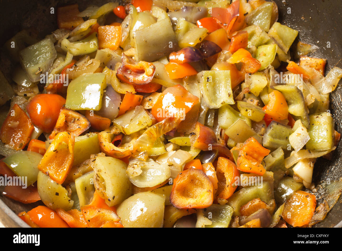 Bell peppers frying in a skillet Stock Photo - Alamy