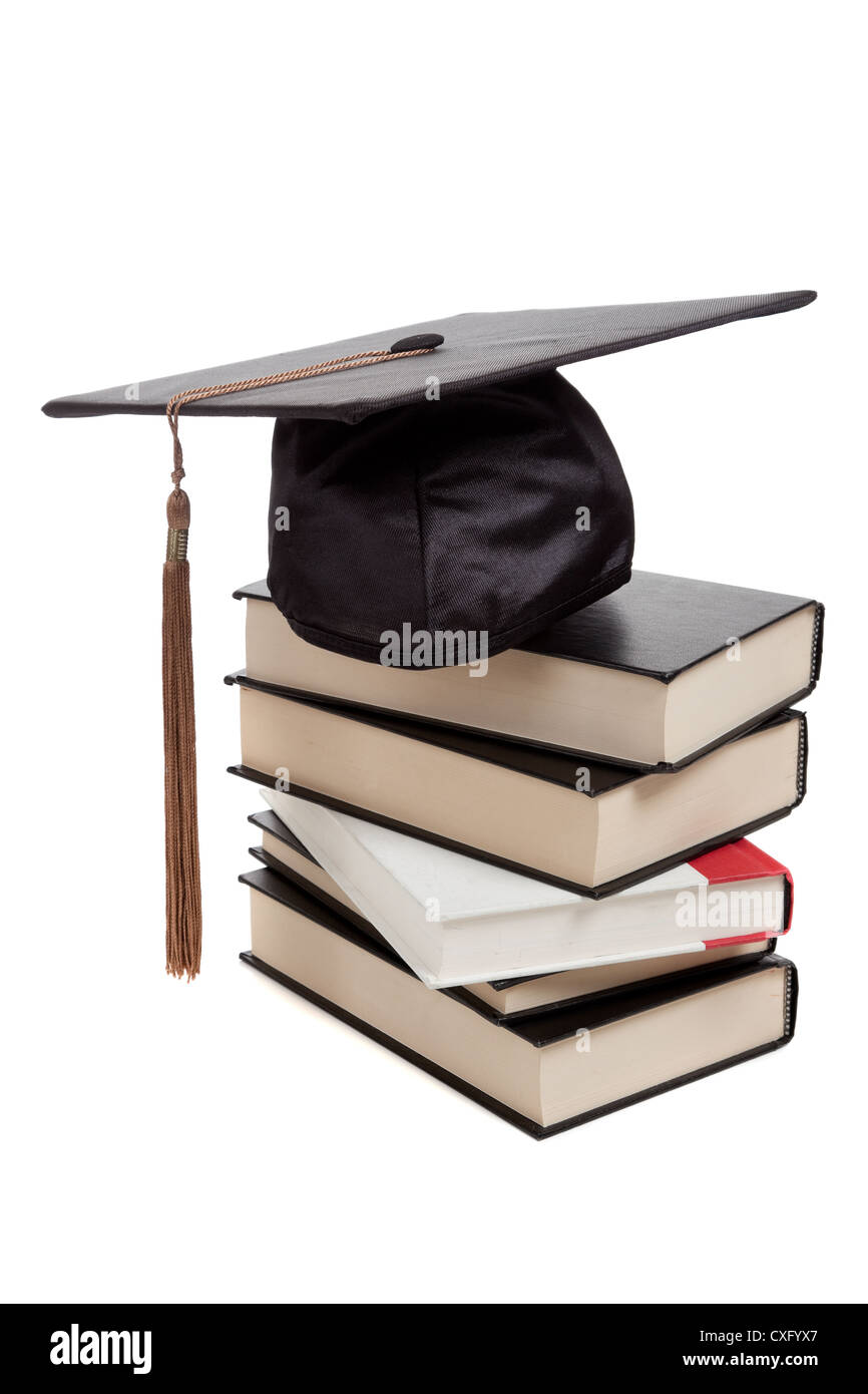 Black graduation cap on a stack of books Stock Photo - Alamy