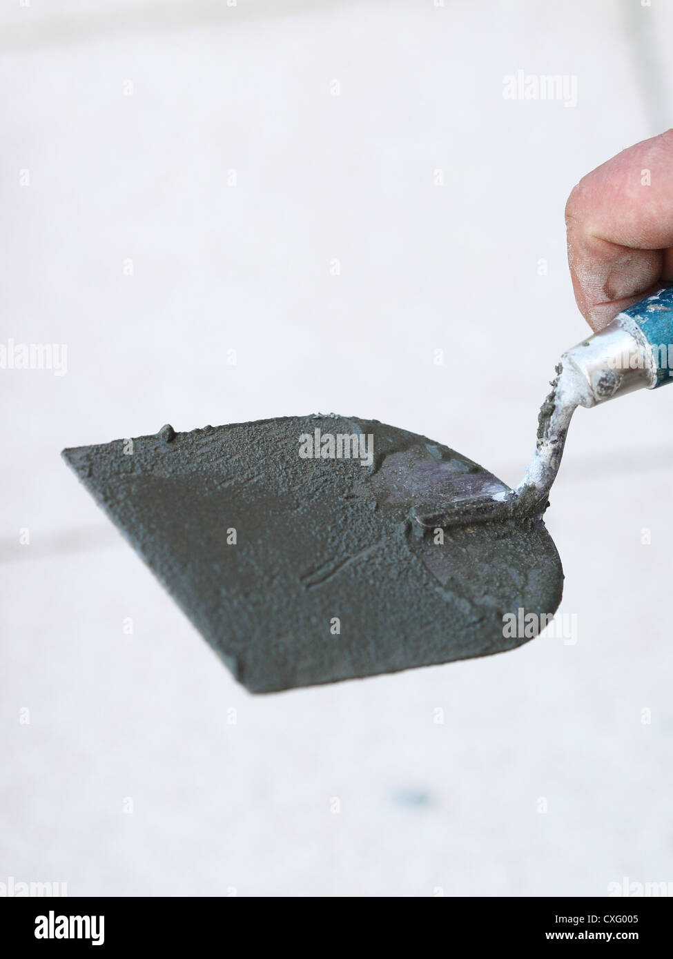 Man Construction worker is tiling at home Stock Photo - Alamy