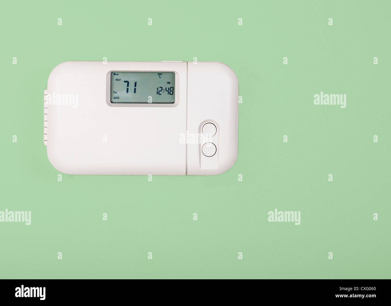 Inside home temperature thermostat set to seventy one degrees ...