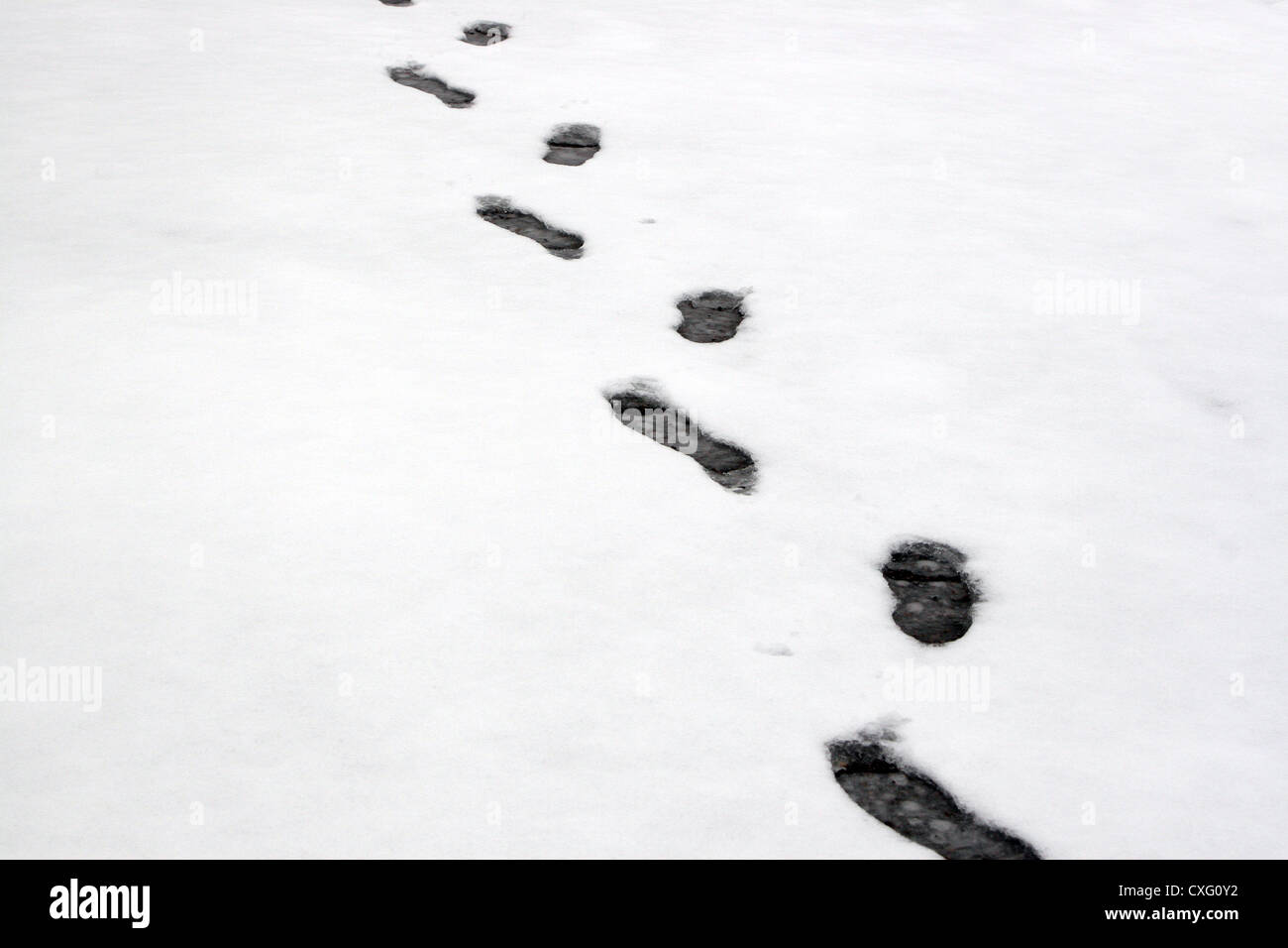 Footsteps in the snow Stock Photo - Alamy