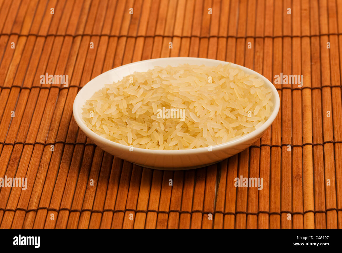 Bowl of white raw uncooked white rice Stock Photo - Alamy