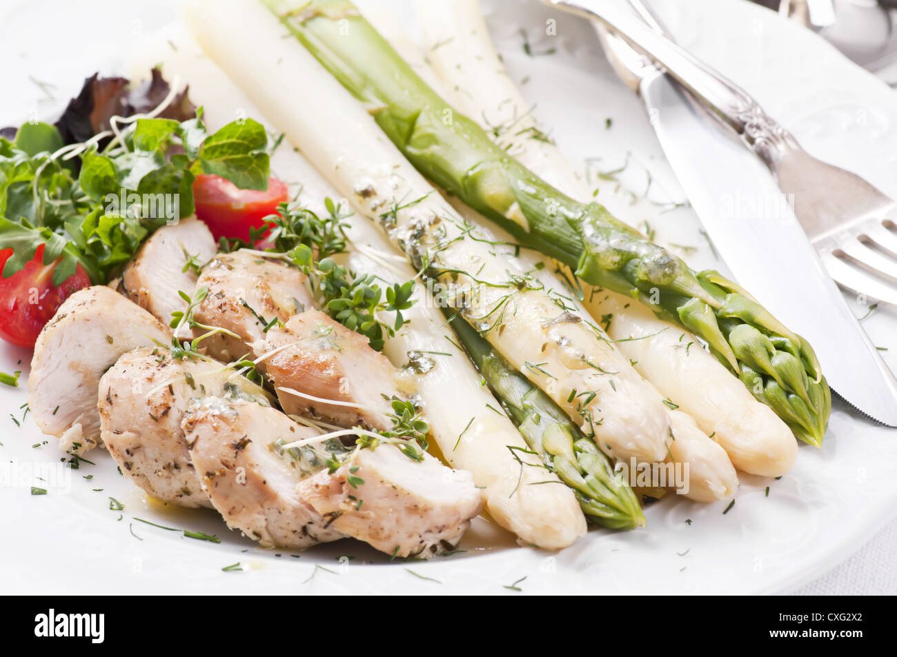 Rabbit fillet roasted with asparagus Stock Photo - Alamy
