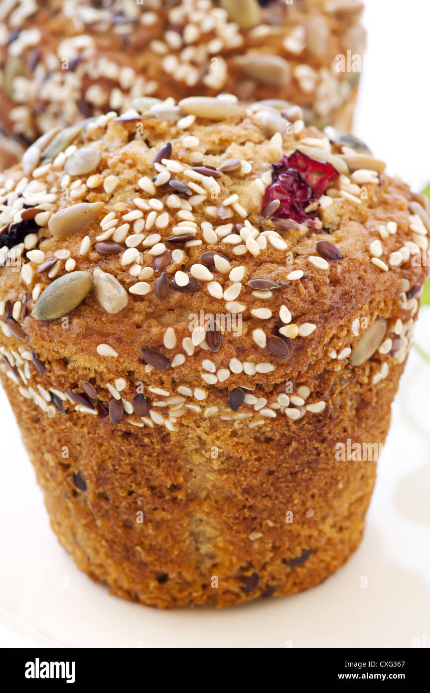 Grain muffin with cherry as closeup on withe background Stock Photo - Alamy