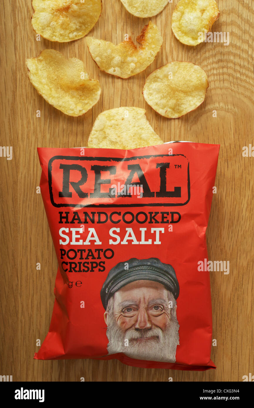 Real hand cooked sea salt potato crisps Stock Photo - Alamy