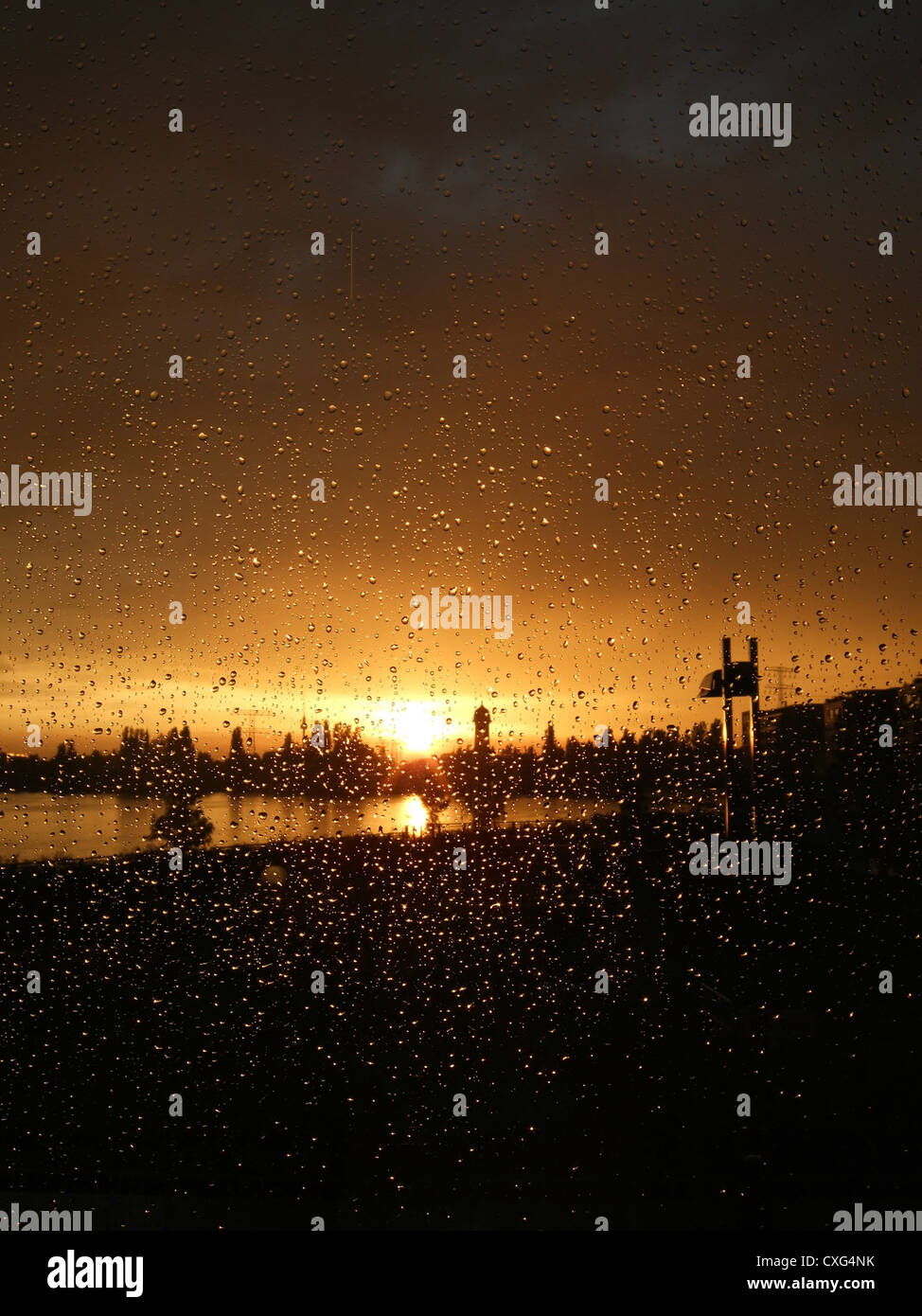 Berlin, raindrops on window pane at sunset Stock Photo - Alamy