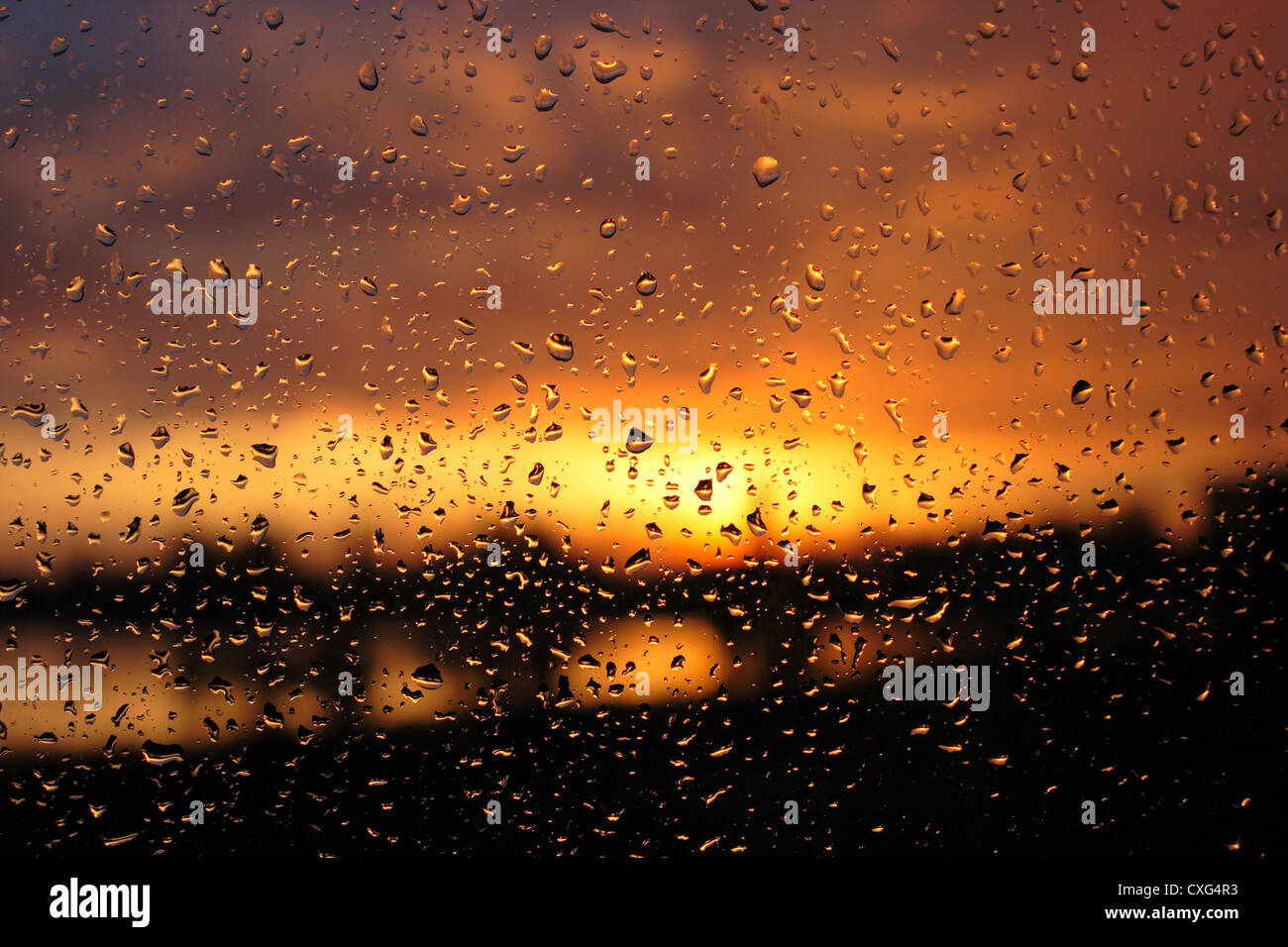 Berlin, raindrops on window pane at sunset Stock Photo - Alamy