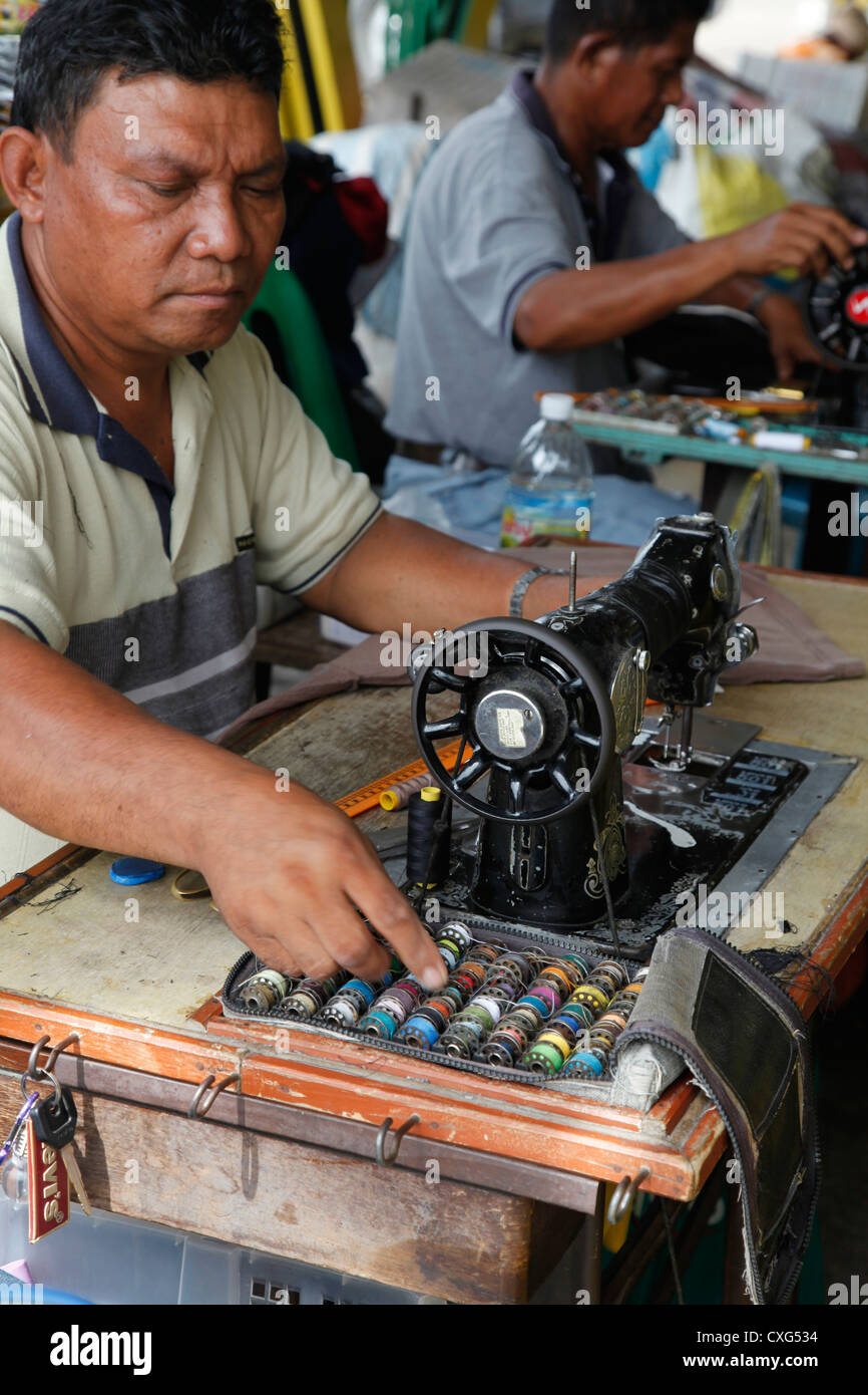 Mending clothes hi-res stock photography and images - Alamy