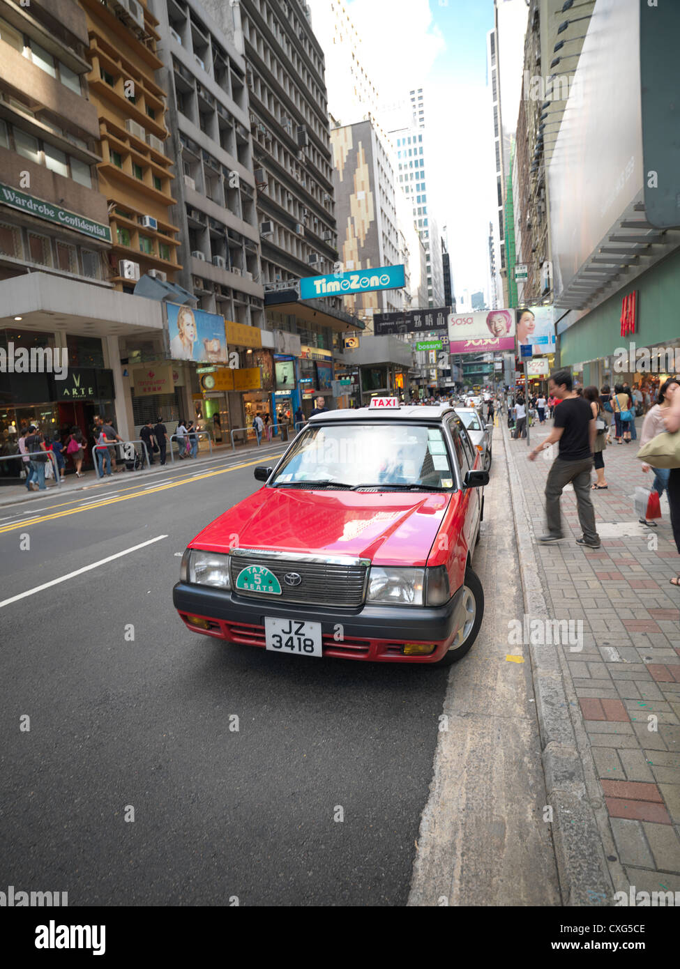 A taxi on a street in Central, Hong Kong Stock Photo - Alamy